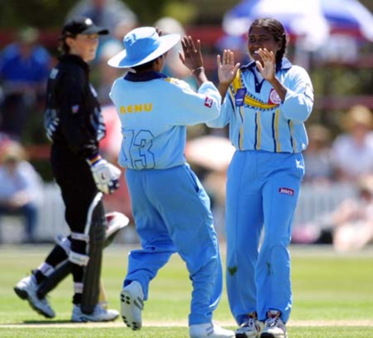 Renu Margrate runs up to congratulate bowler Neetu David after Rebecca ...