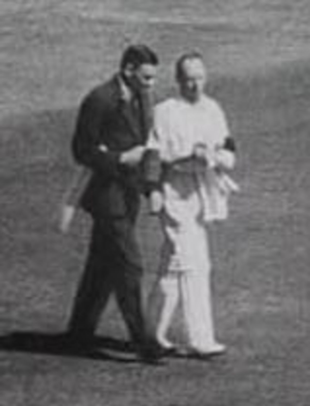 Bert Oldfield is helped off the pitch after being struck by Harold ...