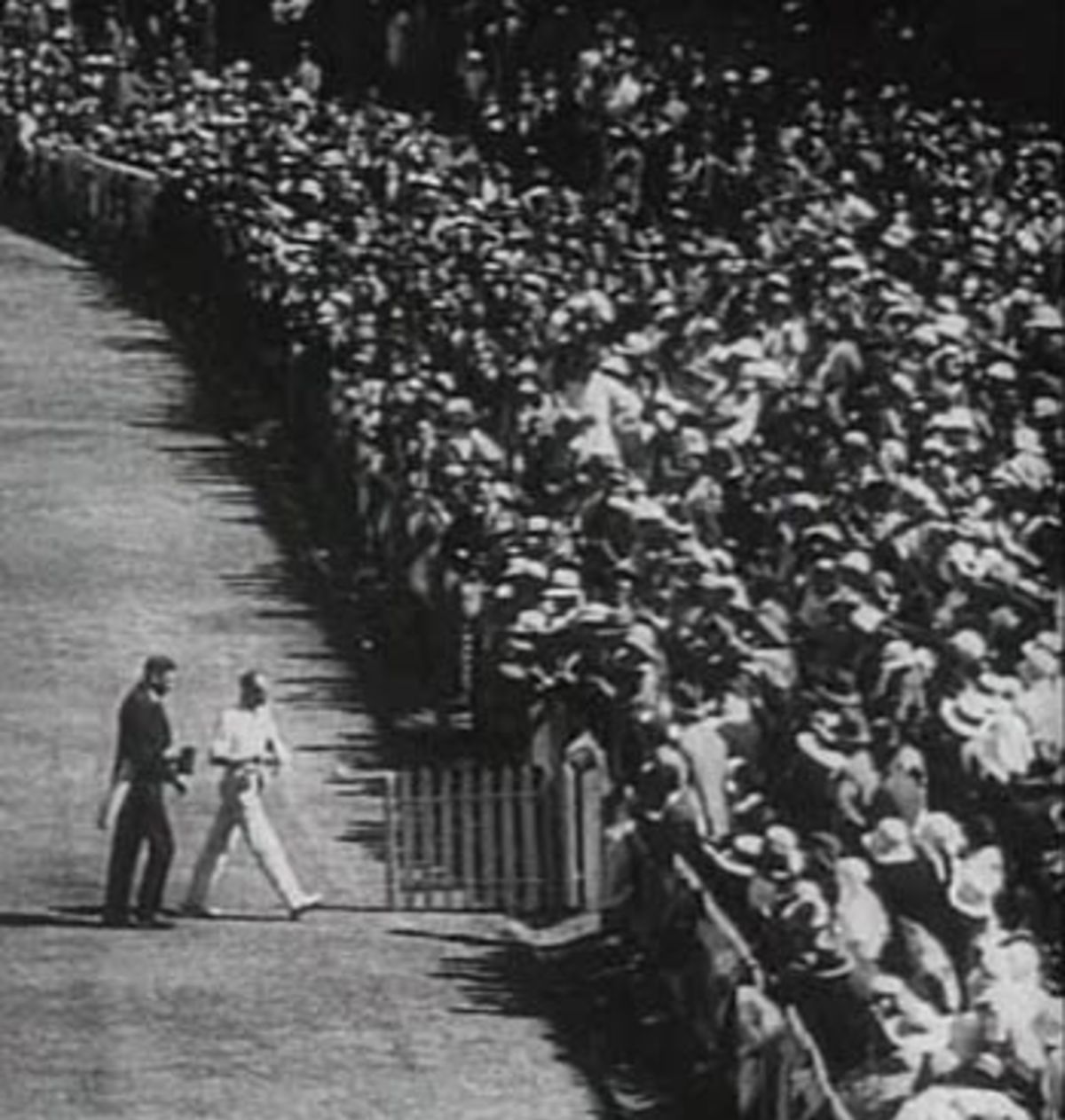 Bert Oldfield is helped off the pitch after being struck by Harold ...