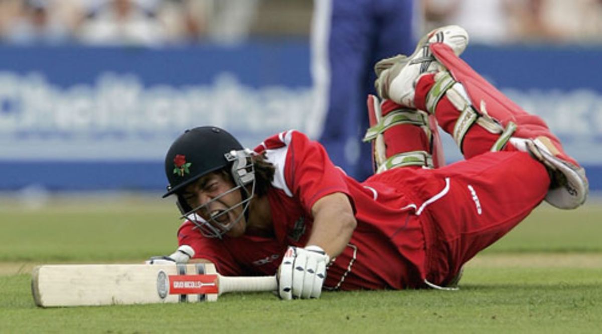 Andrew Symonds raises his bat | ESPNcricinfo.com
