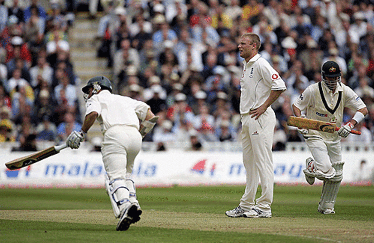 Justin Langer sinks to his knees after receiving a blow from Steve ...