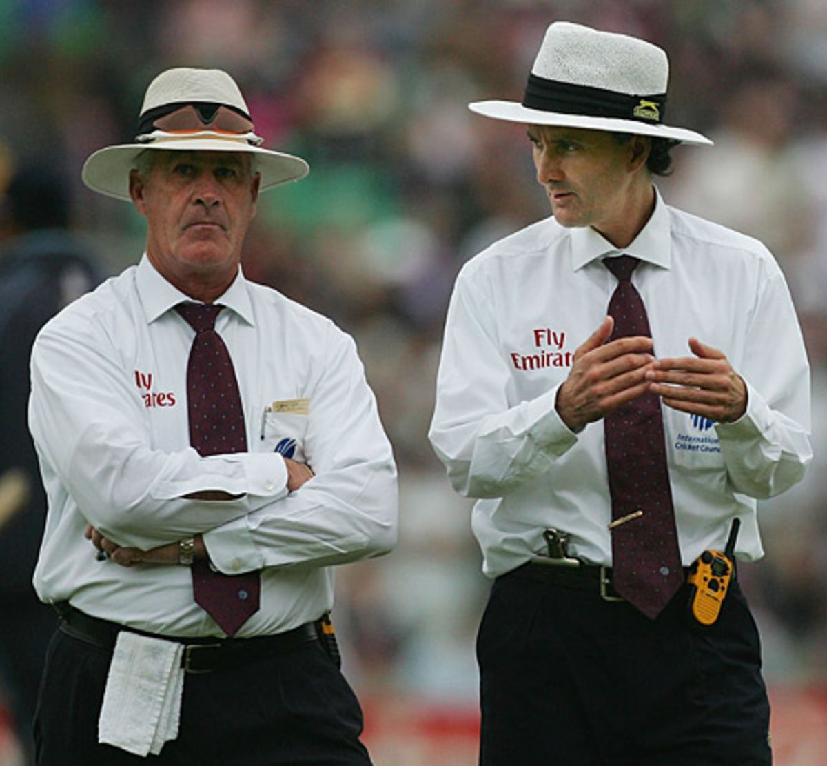Umpires Billy Bowden and Rudi Koertzen discuss the fading light ...