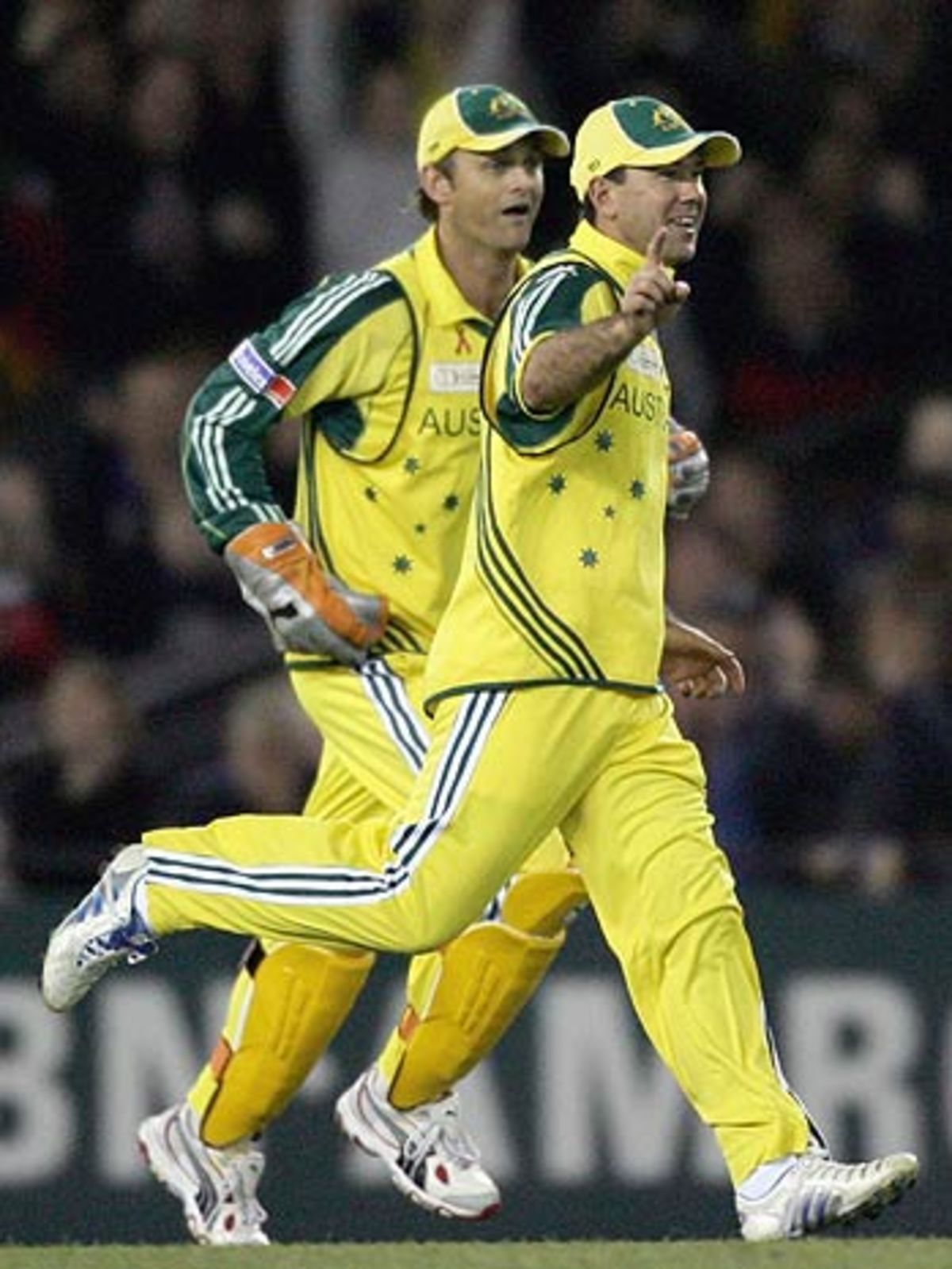 Ricky Ponting and Adam Gilchrist rush to join the celebrations ...