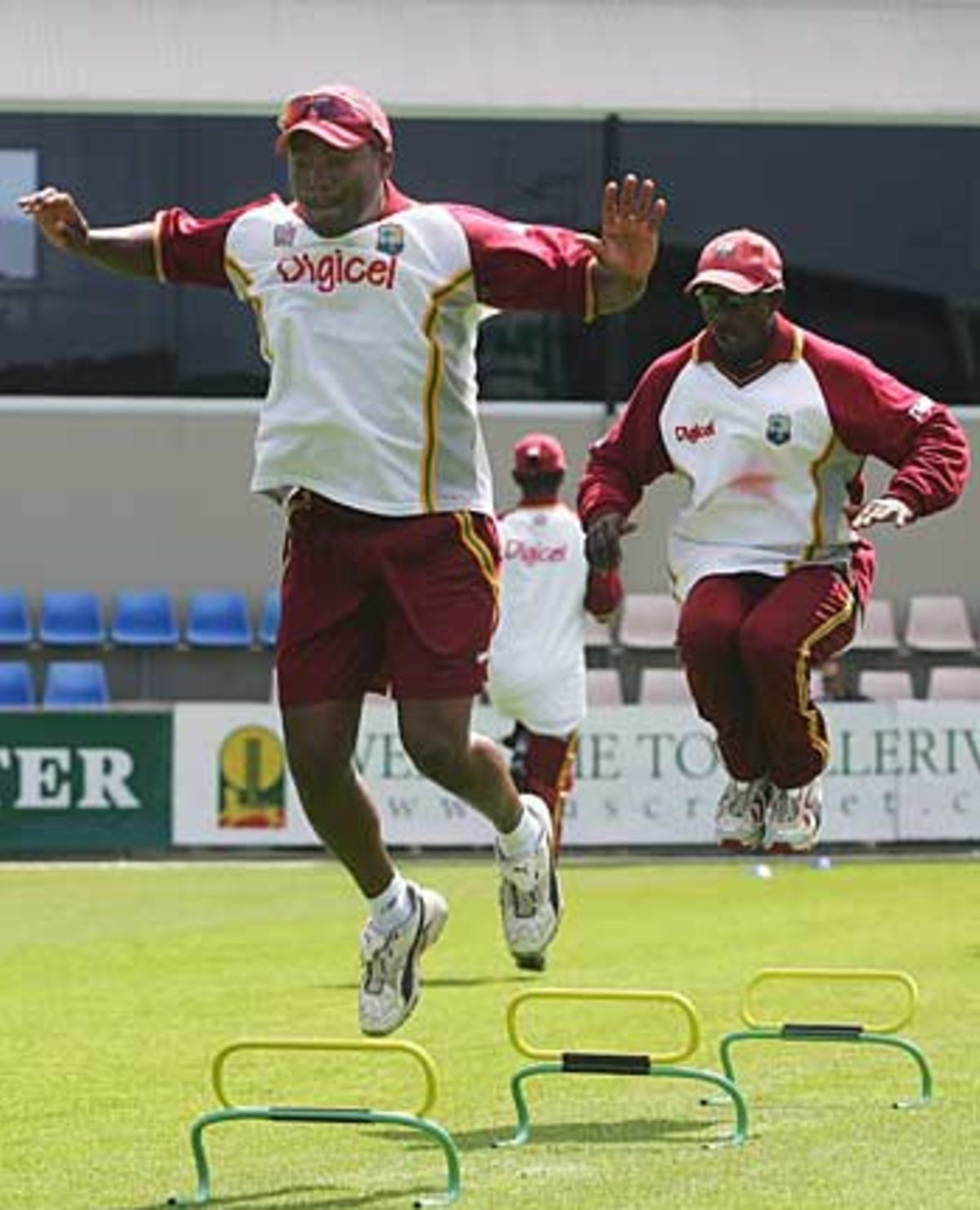 Nathan Bracken and Stuart MacGill look on during training ...