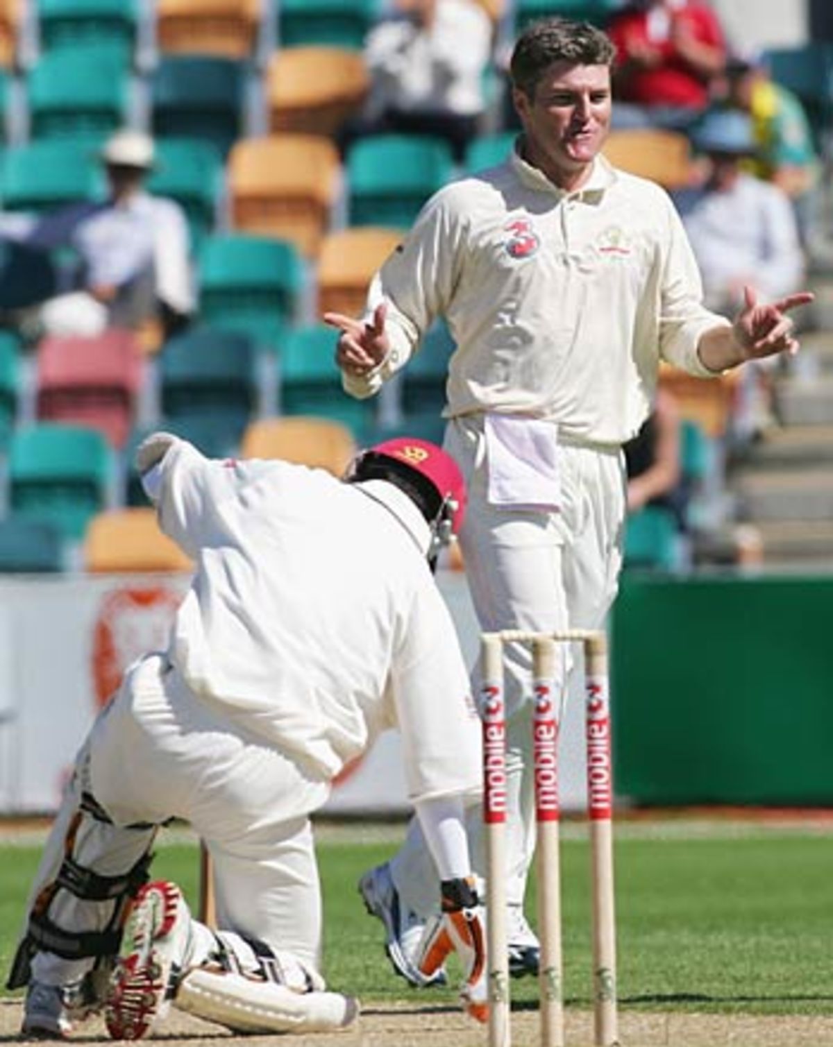 Australian players rush to congratulate Stuart MacGill after he claimed ...