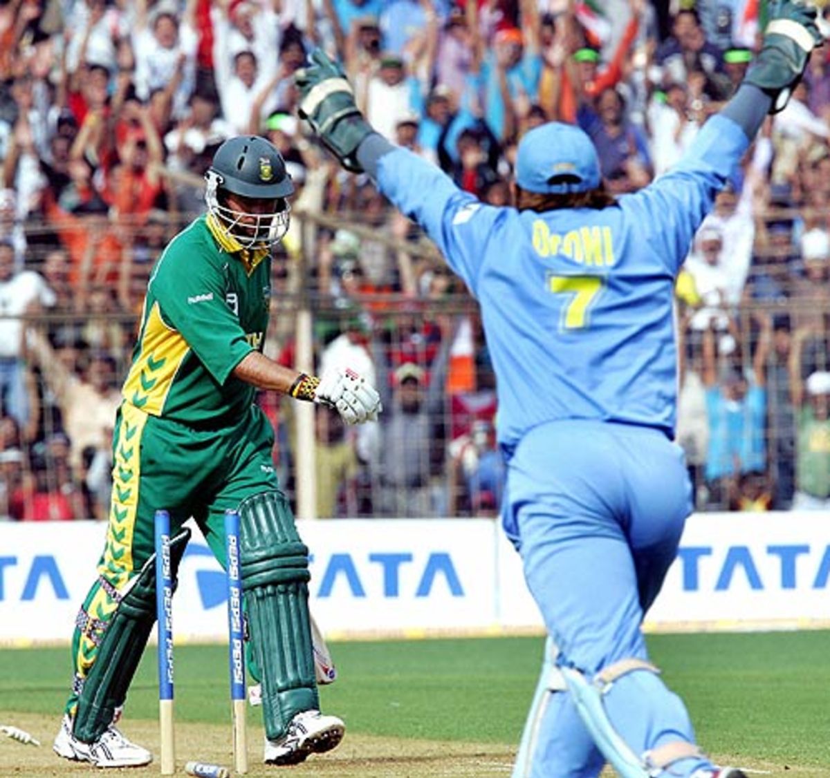 Mahendra Singh Dhoni celebrates as Andrew Hall loses his middle stump ...