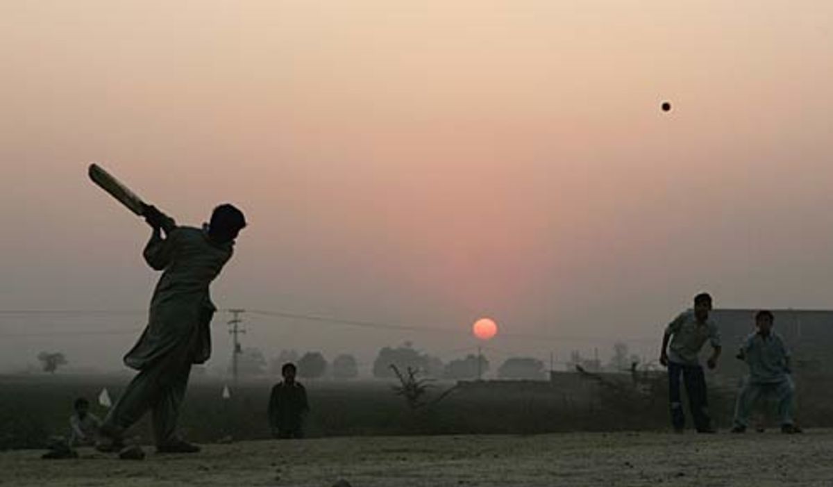 Boys playing cricket at dusk in Lahore | ESPNcricinfo.com