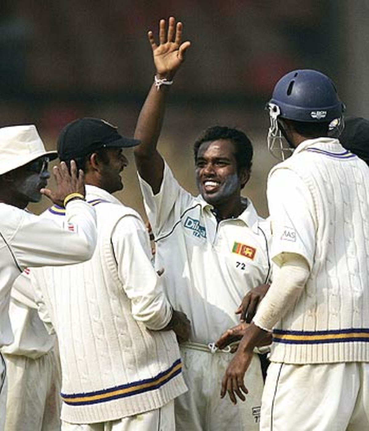 Muttiah Muralitharan looks on as Irfan Pathan walks back to the pavilion | ESPNcricinfo.com