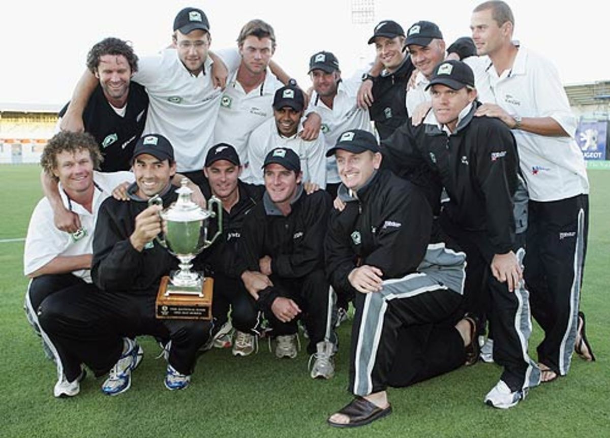The New Zealand team pose with the trophy following their 4-1 series ...