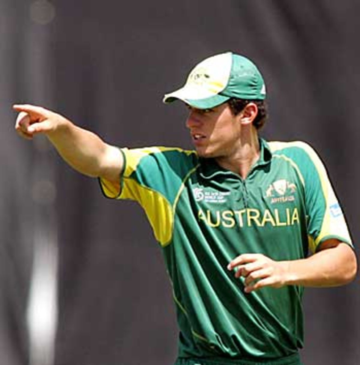 Salman Butt successfully fields the ball at the boundary as the spectators look on ...
