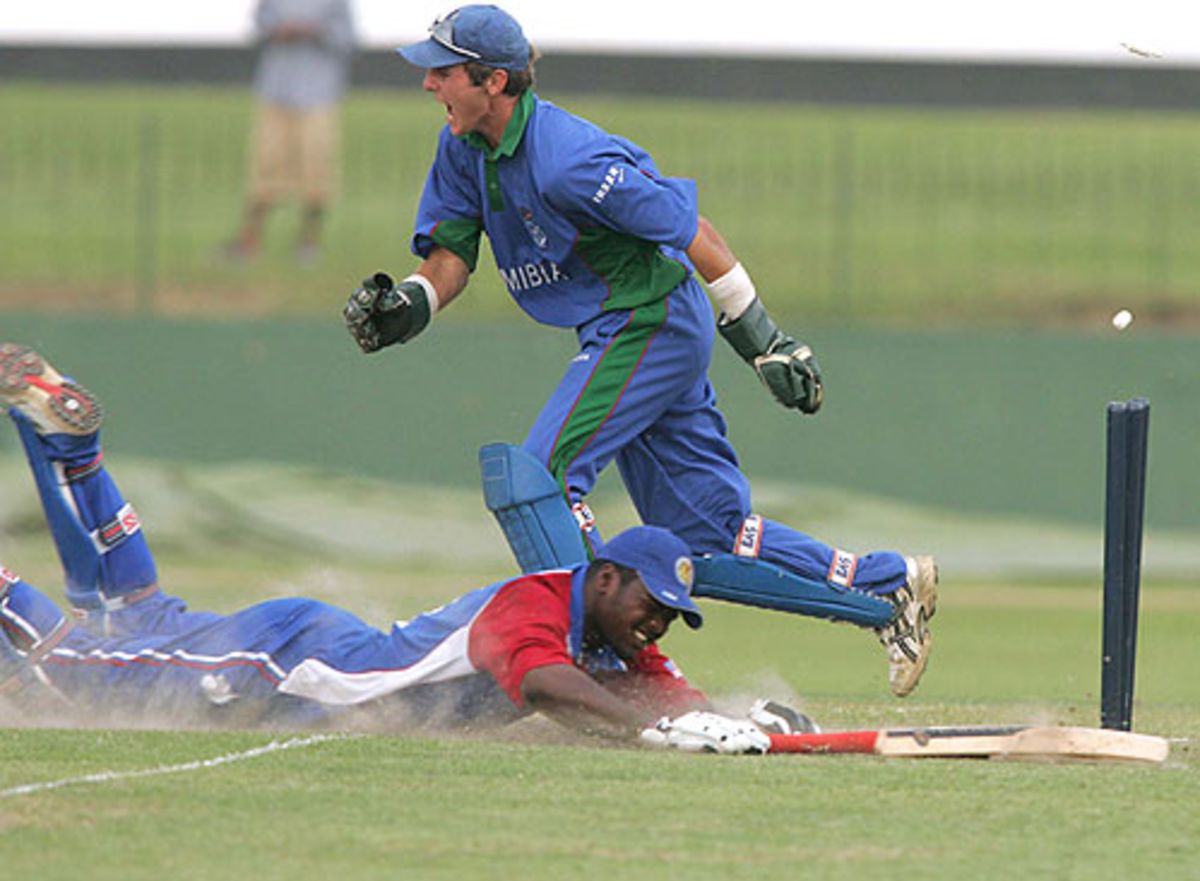 Romeno Deane of the USA is run out as Namibia s Ewald Steenkamp ...