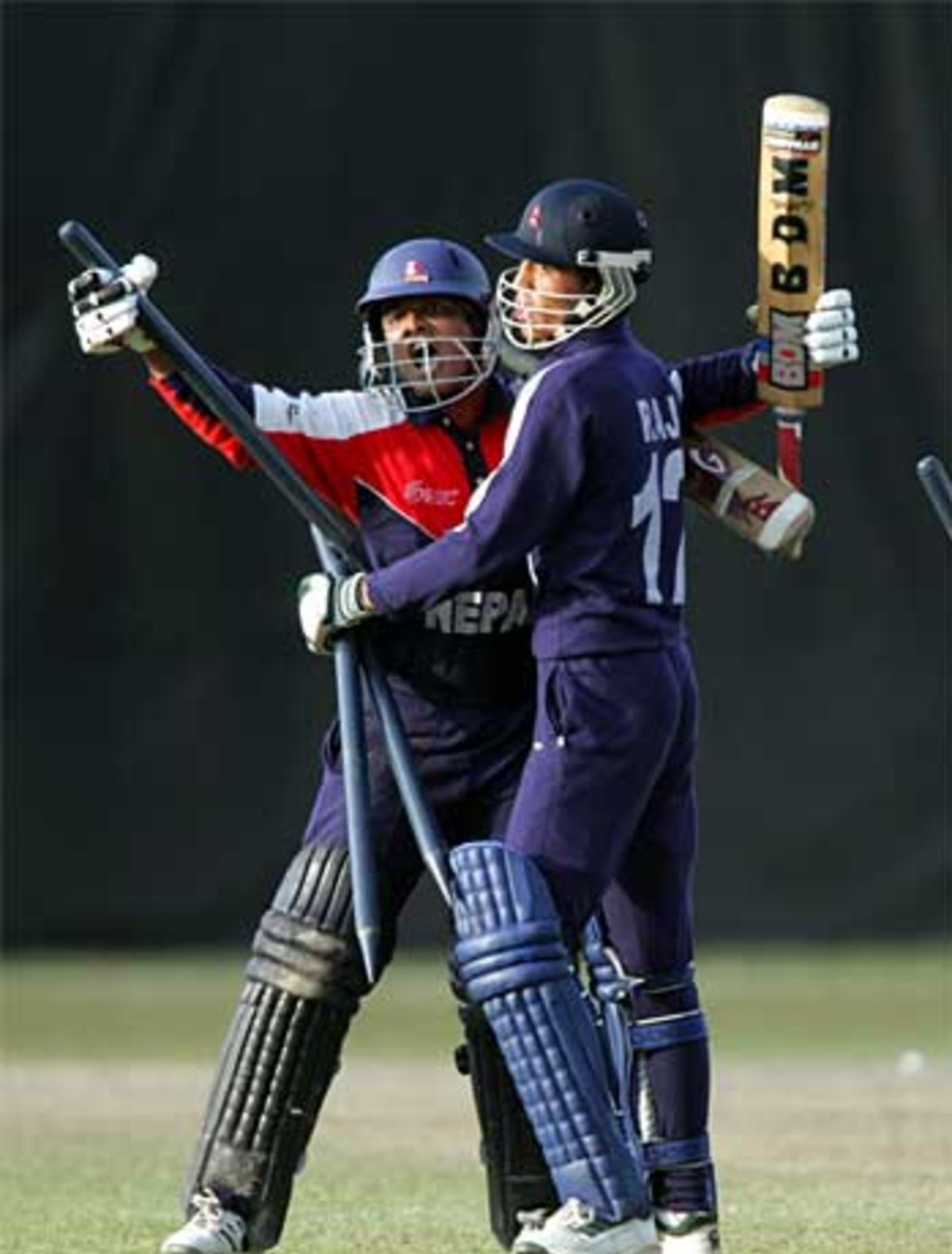 Ratan Rauniyar and Raj Shrestha embrace after Nepal's one-wicket win ...