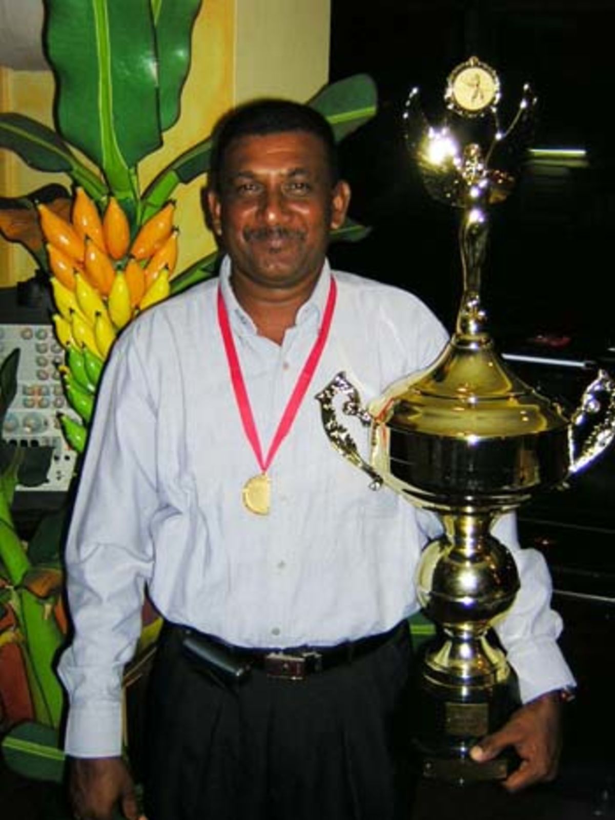 Surinamese captain, Alimoedin Nasrullah, with the Division 3 trophy ...