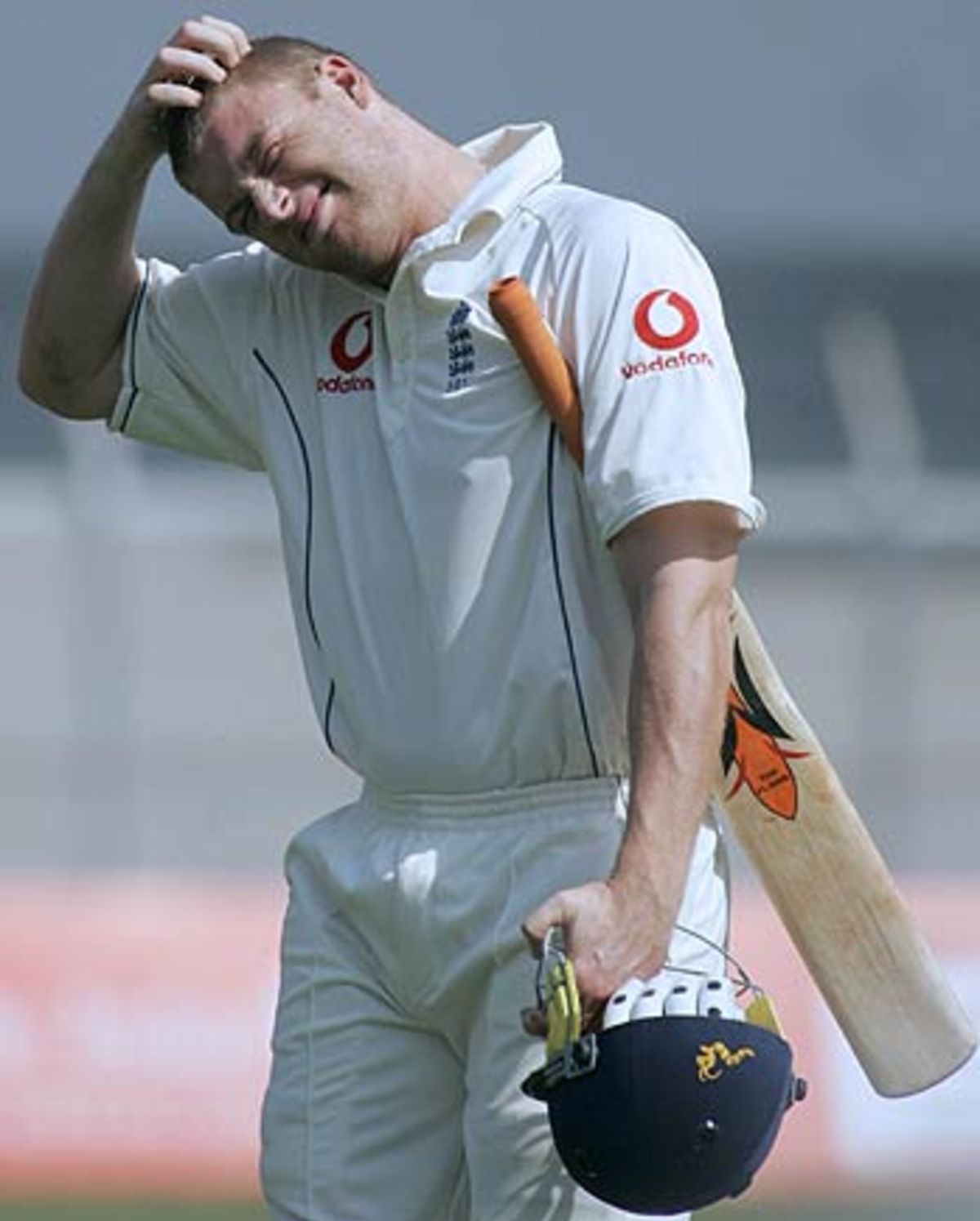 Andrew Flintoff walks back after his brief appearence at the crease ...