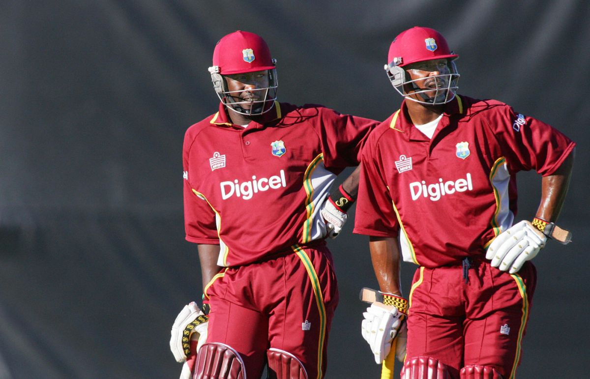 Runako Morton raises his bat after reaching his century | ESPNcricinfo.com
