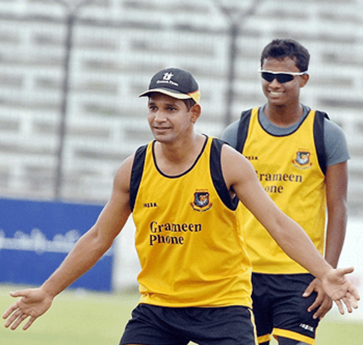 Habibul Bashar engages in a fielding drill as Enamul Haque looks on ...
