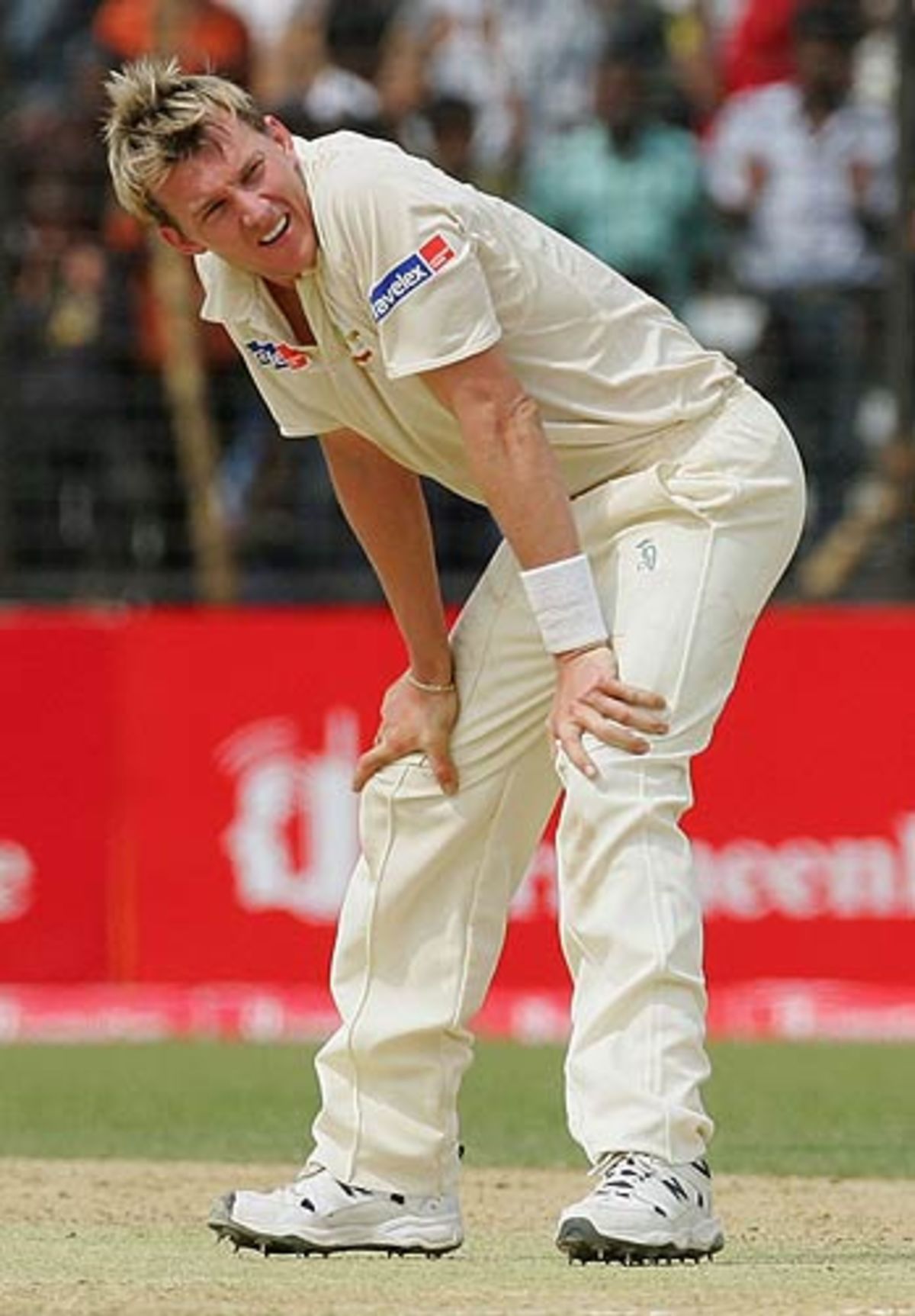 Brett Lee looks helpless as the ball sails away to the fence ...