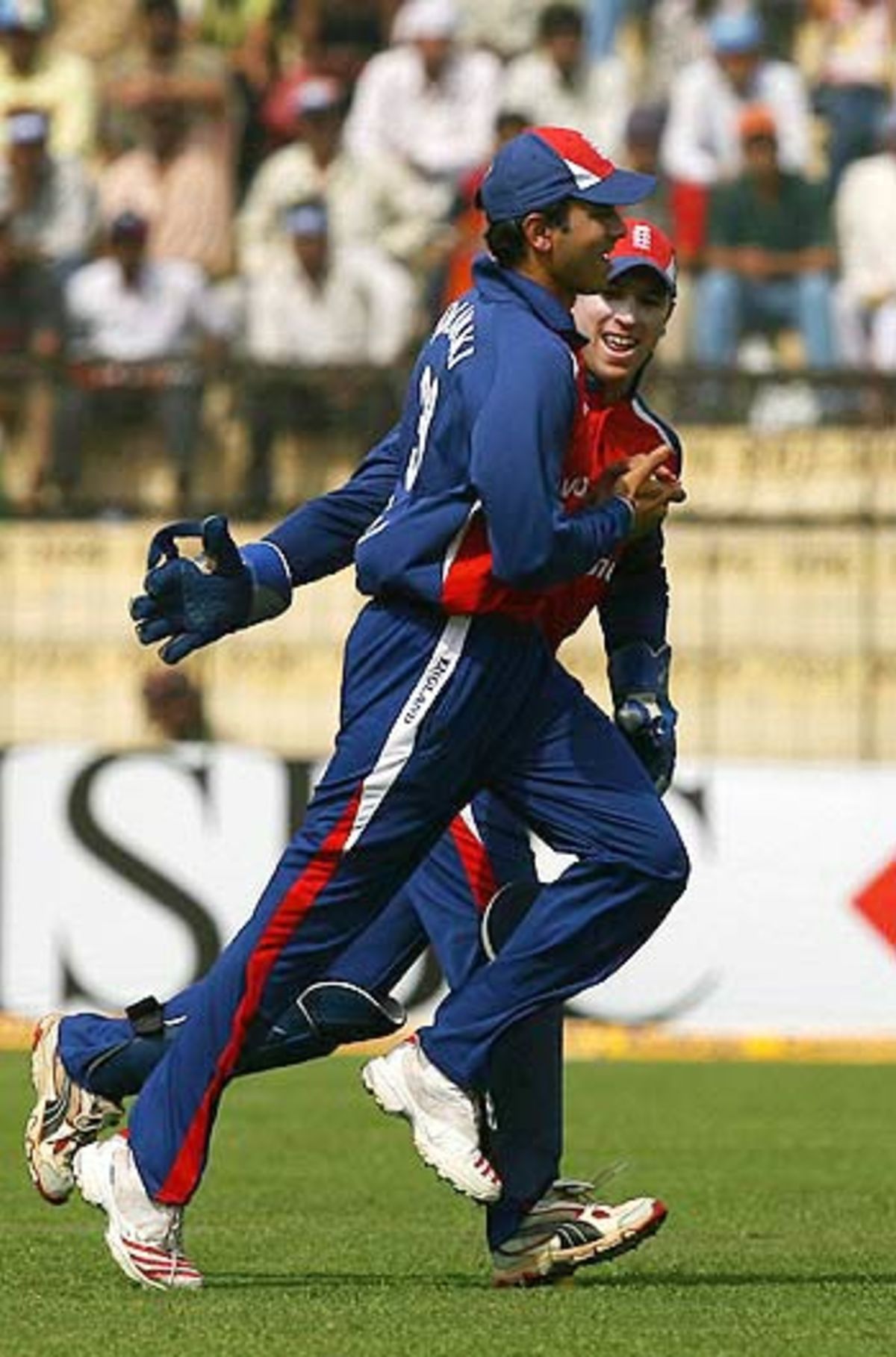 Matthew Hoggard lunges to field a thumping hit from Mahendra Singh ...