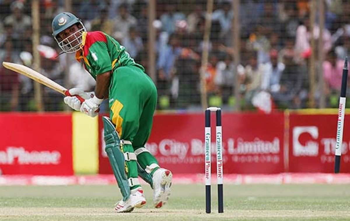 Khaled Mashud watches as his leg stump was uprooted out of the ground ...