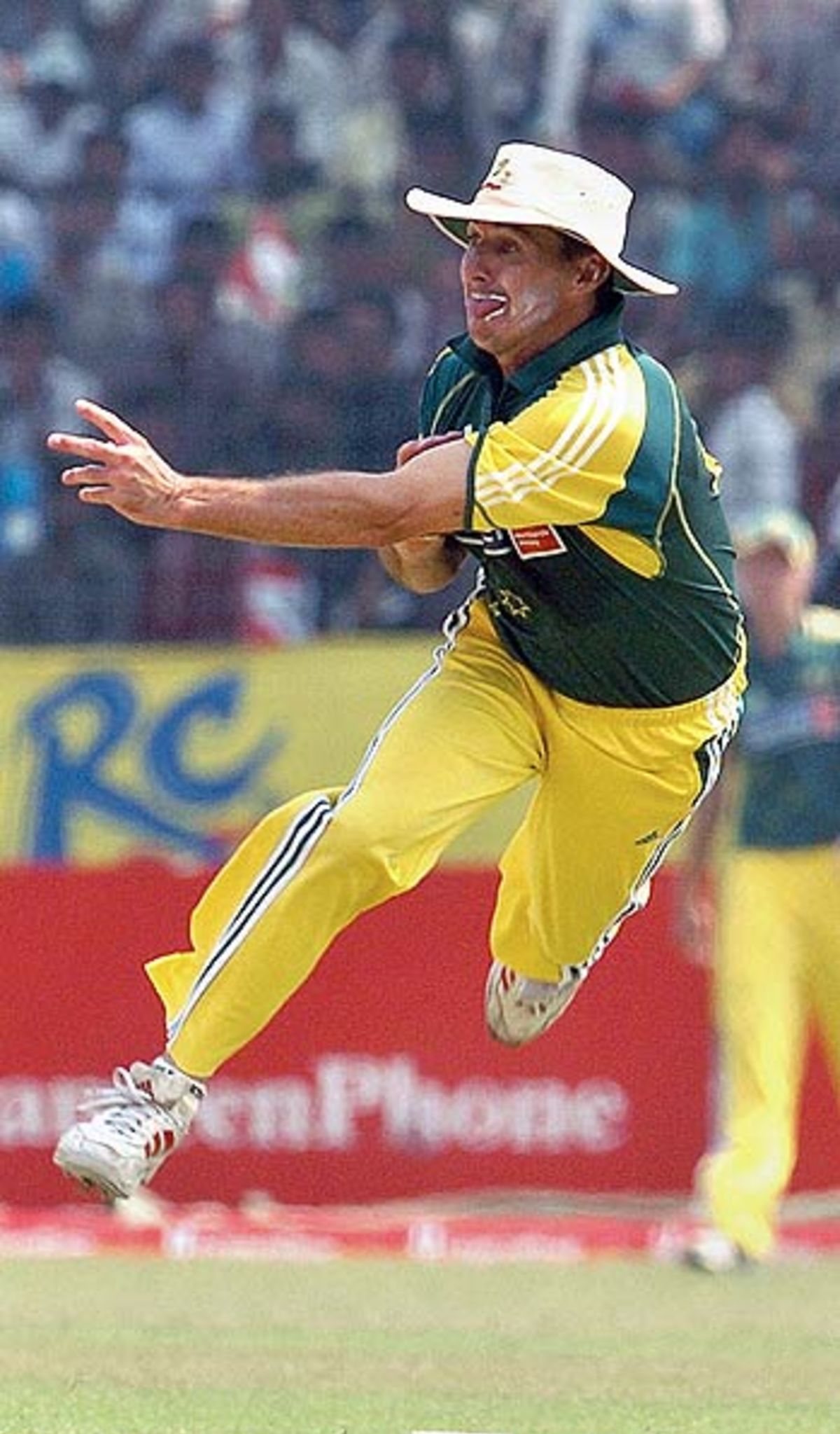 Brad Hogg fires in a throw into the stumps | ESPNcricinfo.com