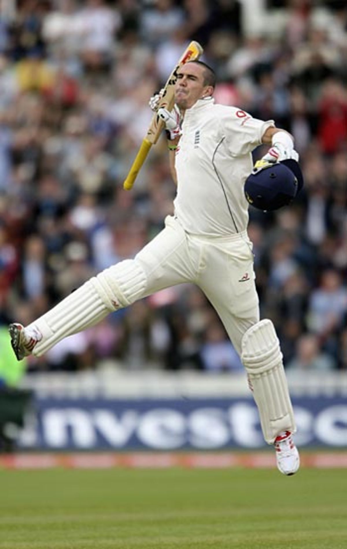 Kevin Pietersen launches his bat into the air on reaching his fourth ...