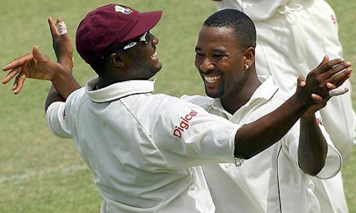 Corey Collymore and Brian Lara celebrate Virender Sehwag's wicket ...