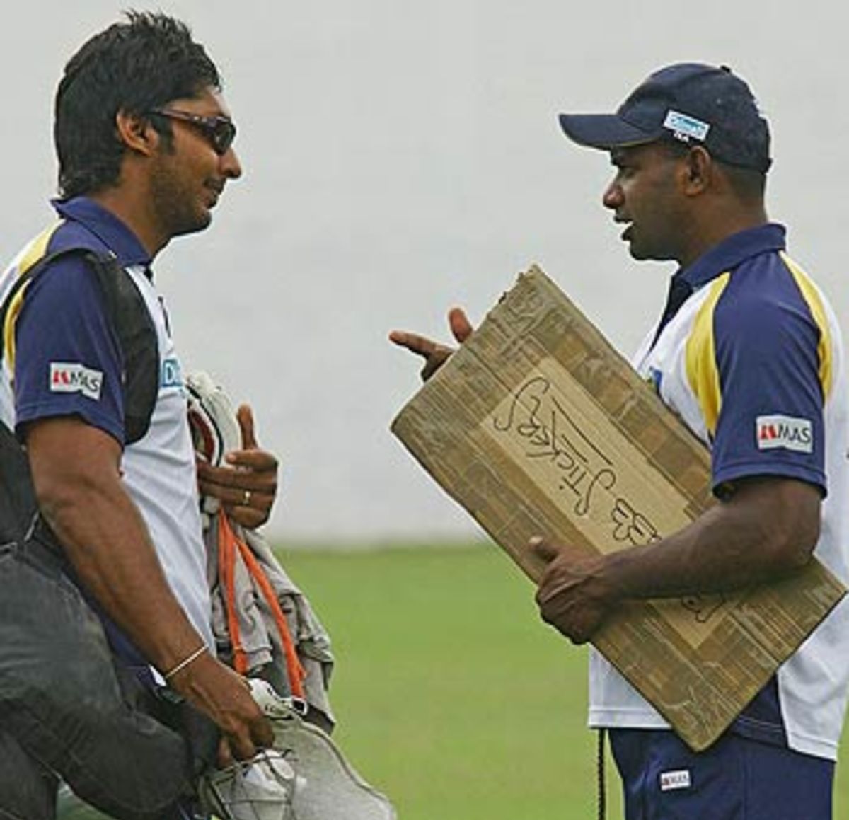 Sanath Jayasuriya makes a point to Kumar Sangakkara during training ...