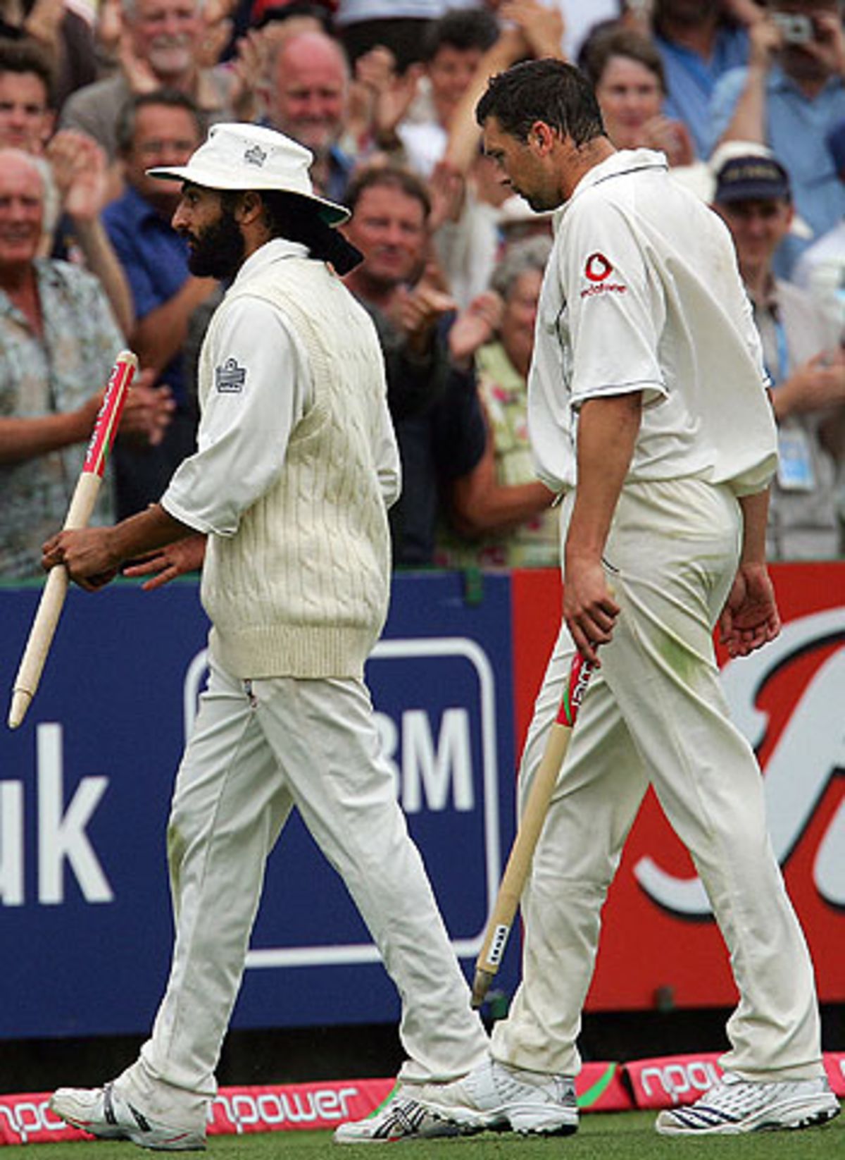 Monty Panesar celebrates another wicket with Alastair Cook ...