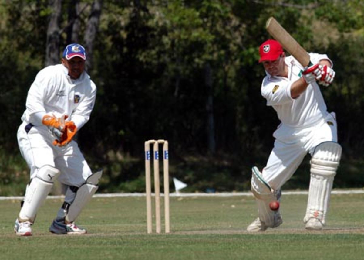 Ian Billcliff drives for four towards his century, Dean Minors is the ...