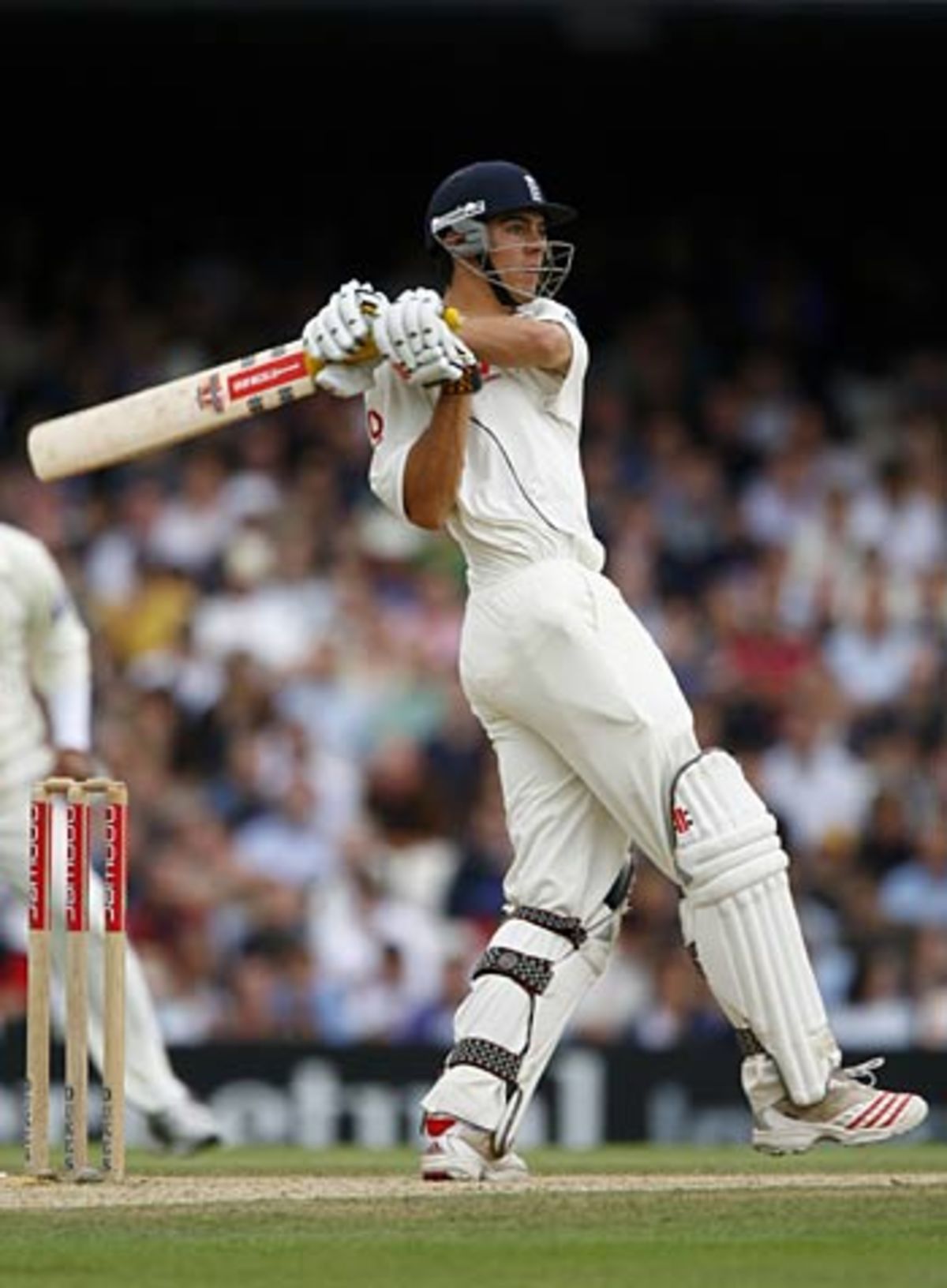 The Pakistan players huddle around the umpires as the ball is changed ...