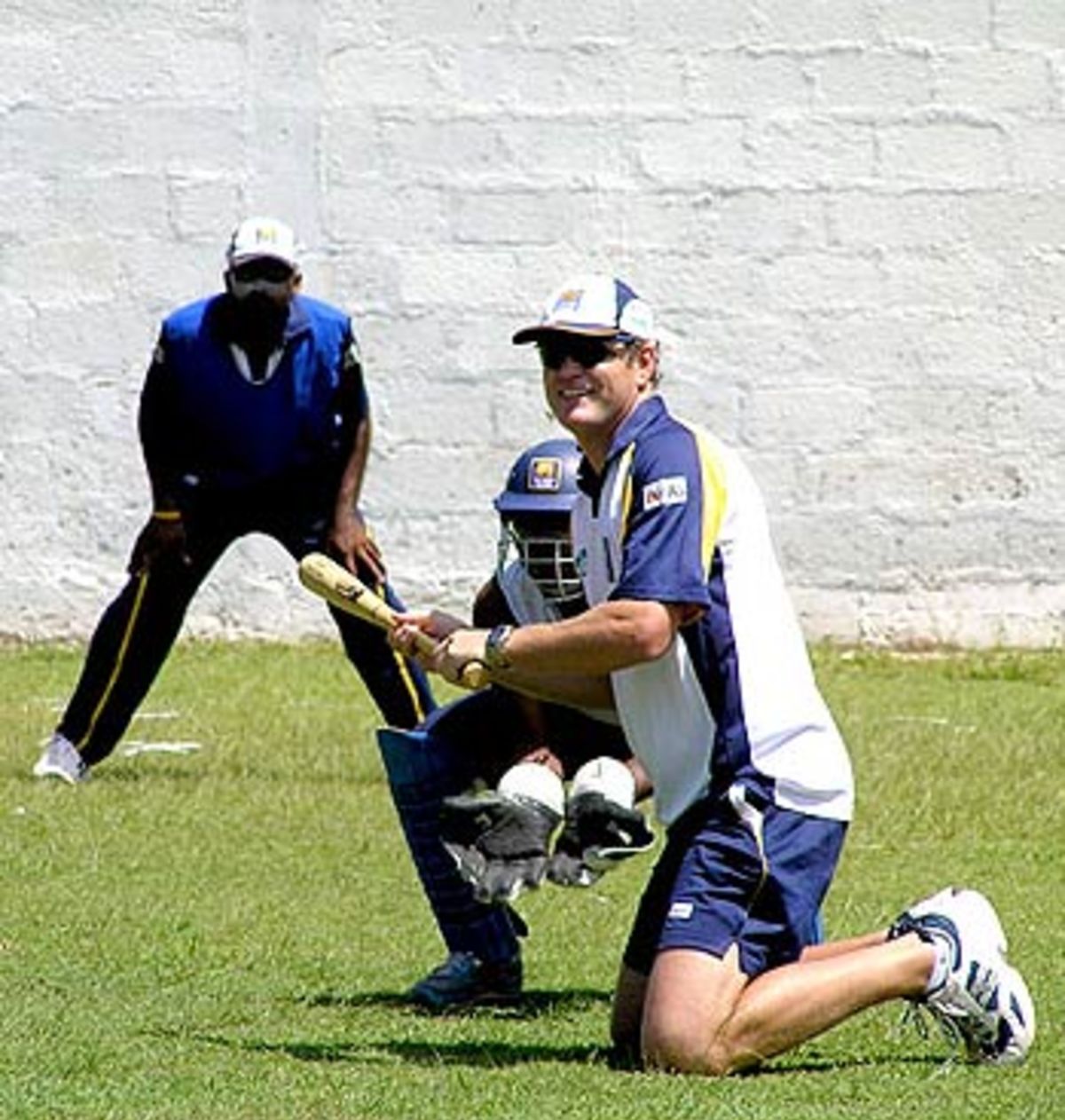 Tom Moody gives slip-catching practice with a baseball bat ...