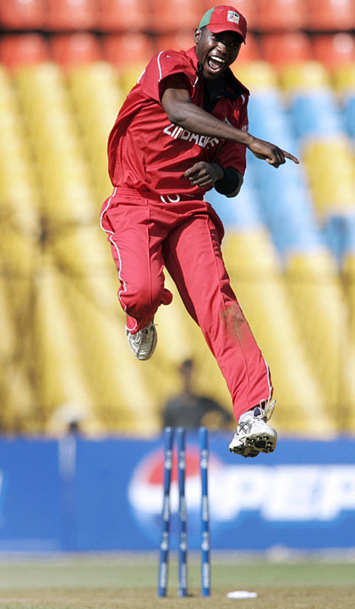 A delighted Elton Chigumbura celebrates running out Sanath Jayasuriya ...