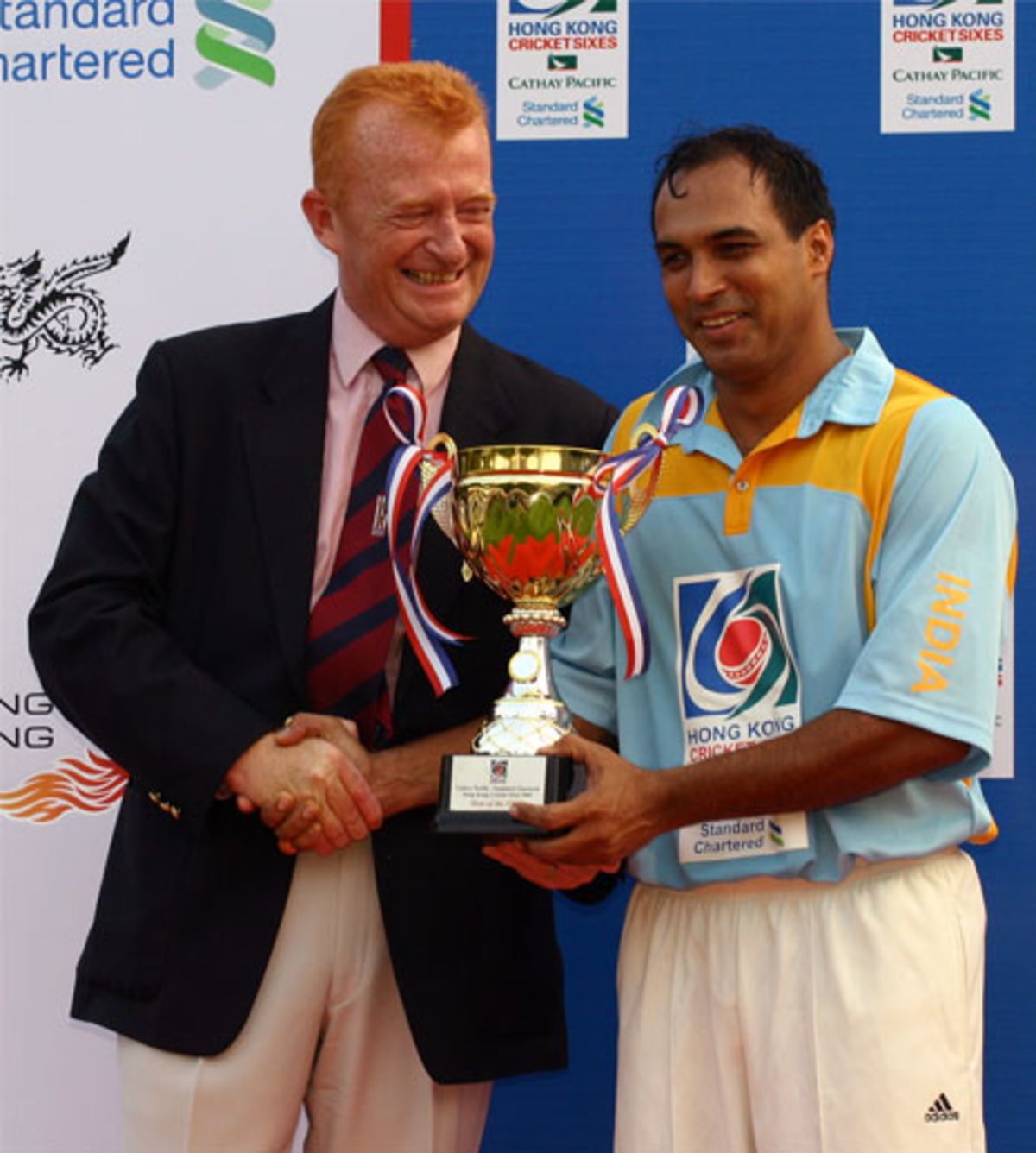 India captain Robin Singh accepts the winners trophy from HKCA Chairman ...