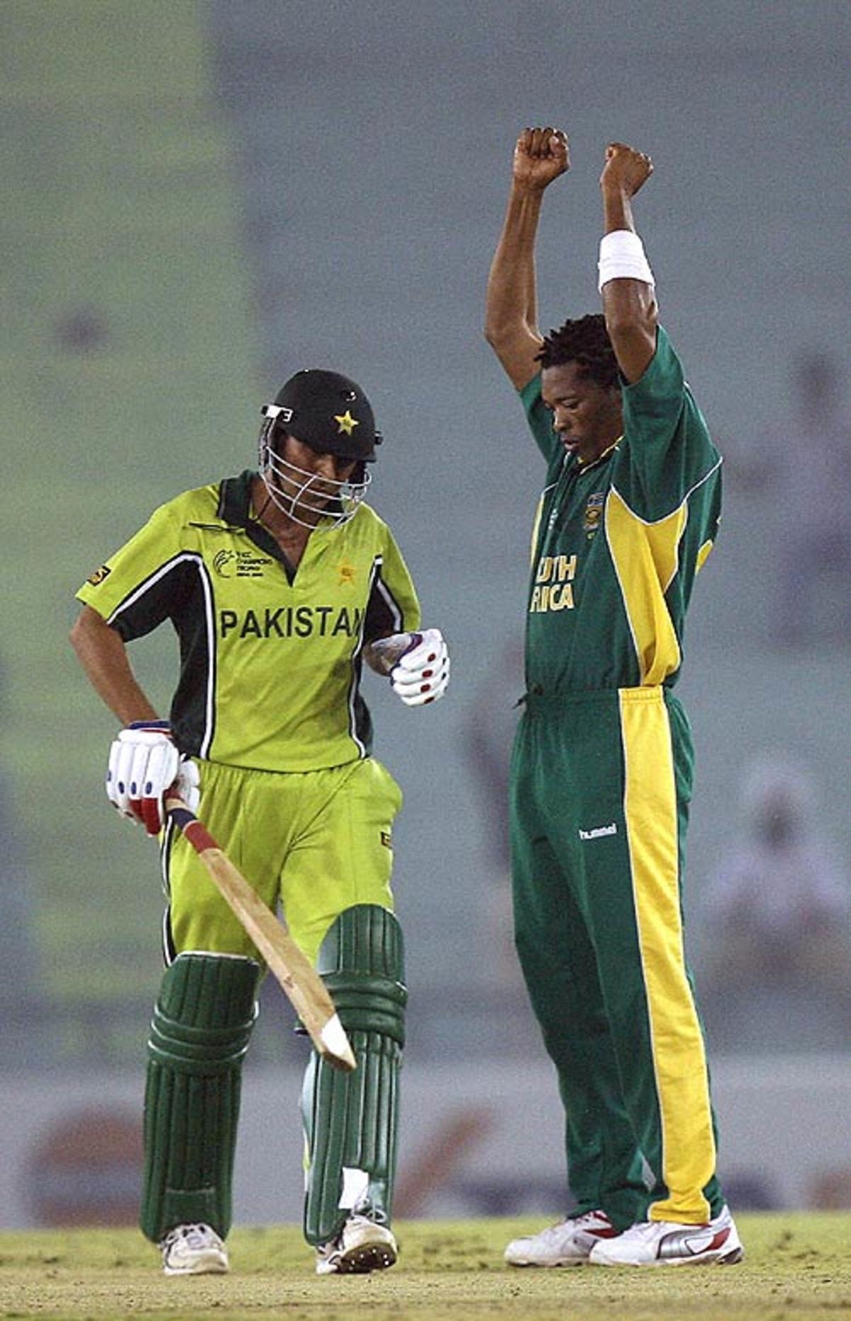 Shoaib Malik looks on after an edge to the leg side is snatched up from ...