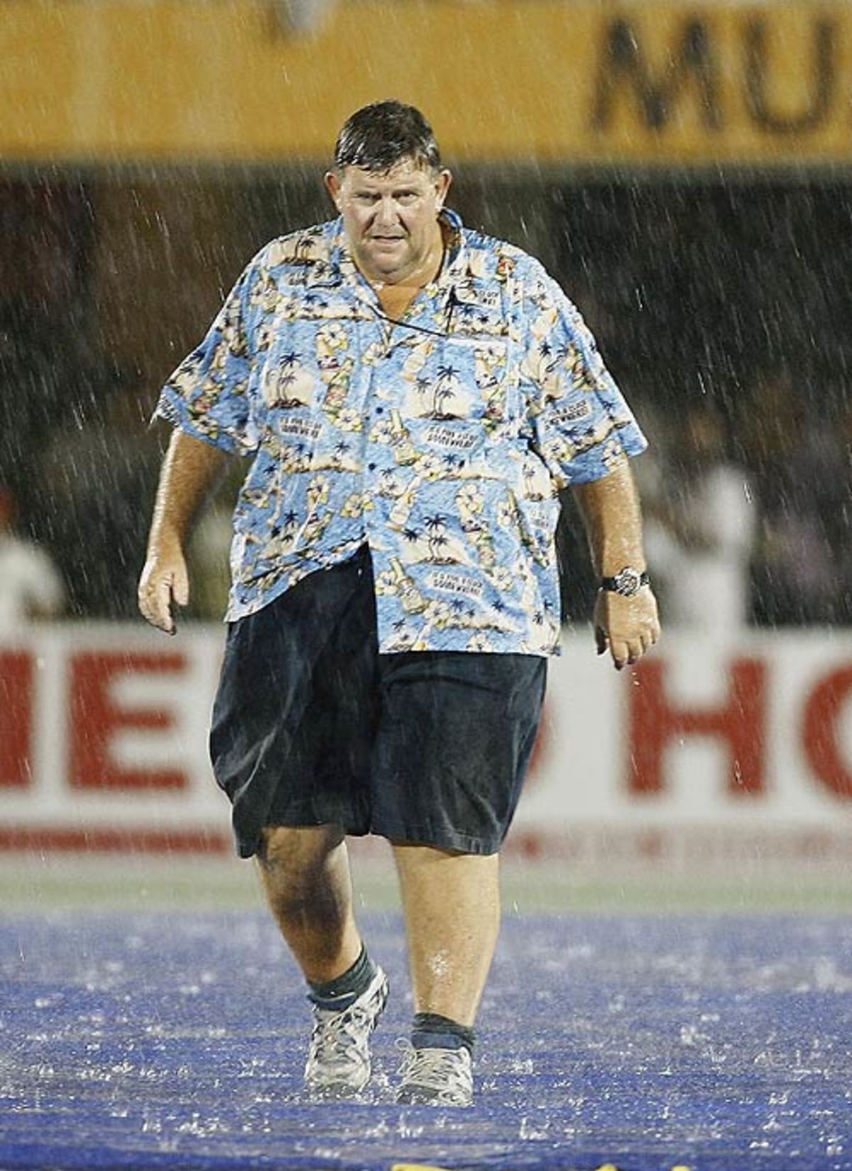 Andy Atkinson inspects the wet conditions | ESPNcricinfo.com
