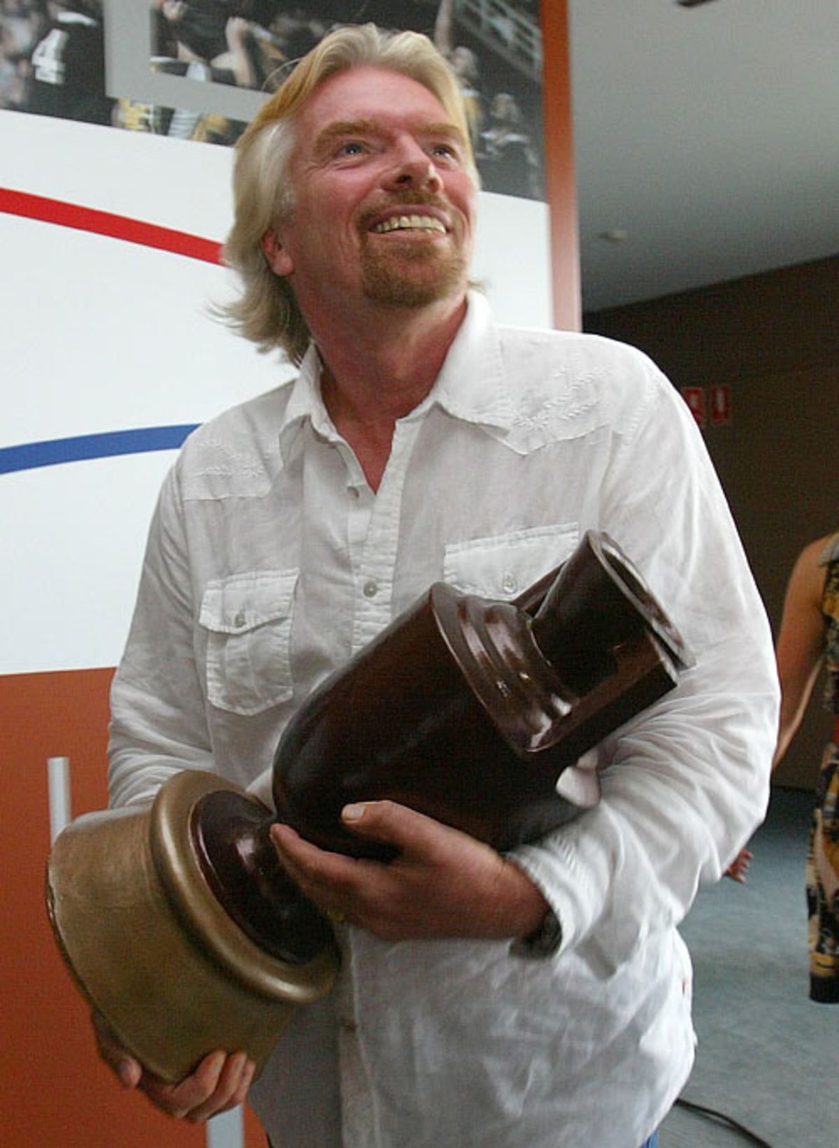 Richard Branson carries a replica of the Ashes urn | ESPNcricinfo.com