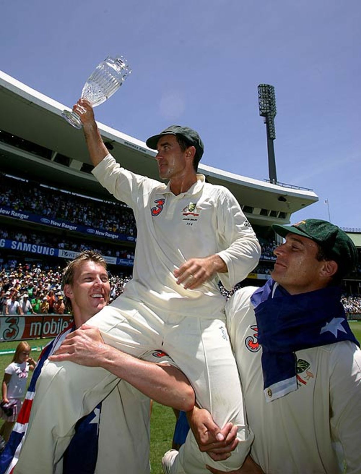 Michael Clarke and Andrew Symonds chair Shane Warne off the SCG in his ...