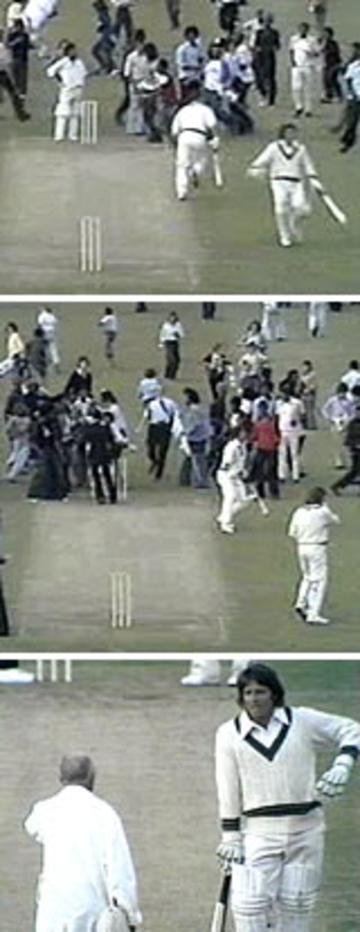 Clive Lloyd ushers fans off the field during his hundred in the 1975 ...
