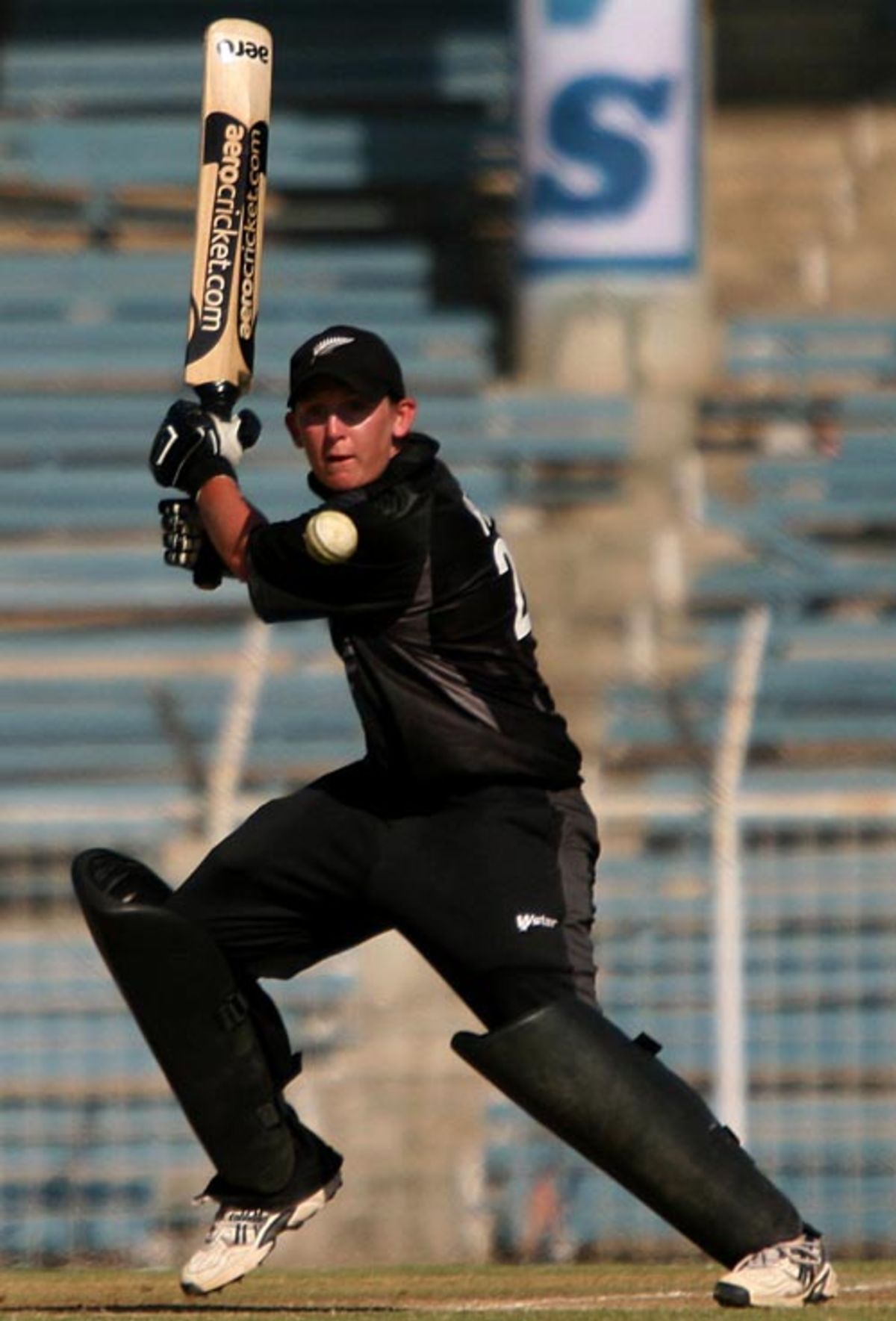 Maria Fahey (left) and Helen Watson of New Zealand cross over for a ...
