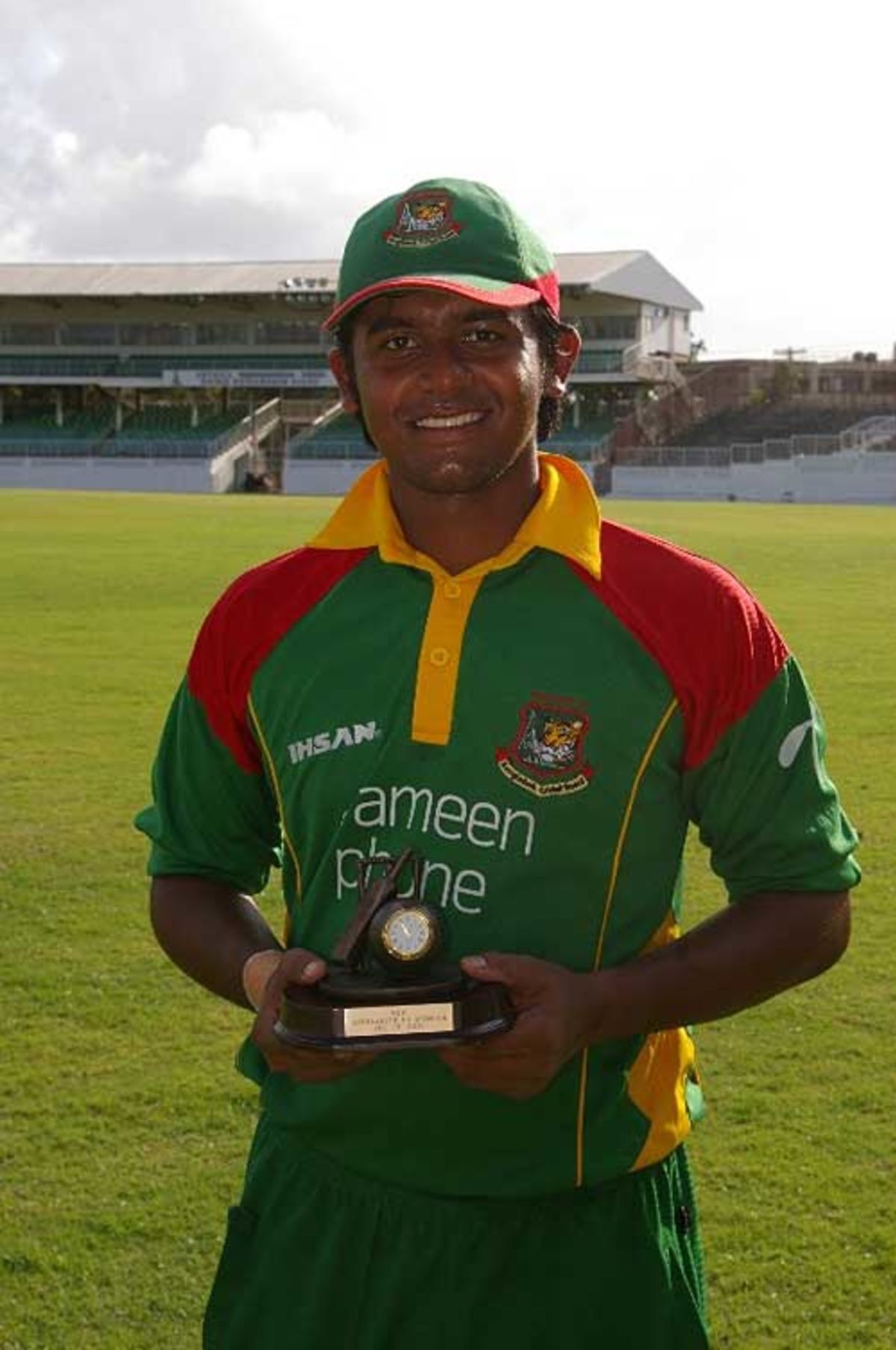 Shahriar Nafees poses with his man-of-the-match award following his ...