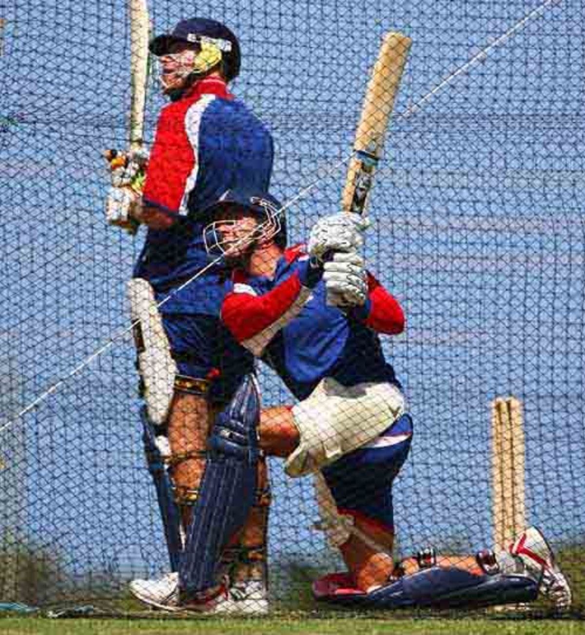 Rahul Dravid lines up for a paddle sweep during India's net session ...