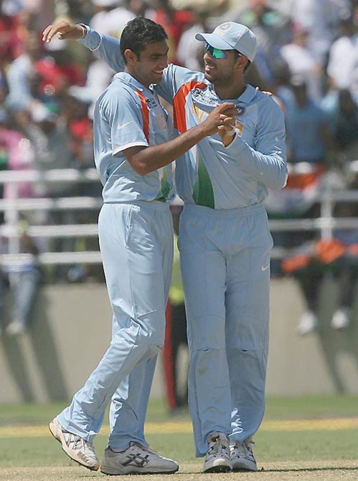 Munaf Patel, the pick of India's bowlers on the day, is congratulated ...