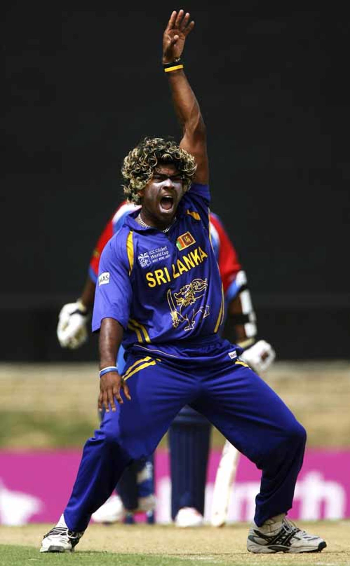Lasith Malinga appeals successfully for the wicket of Irvine Romaine ...