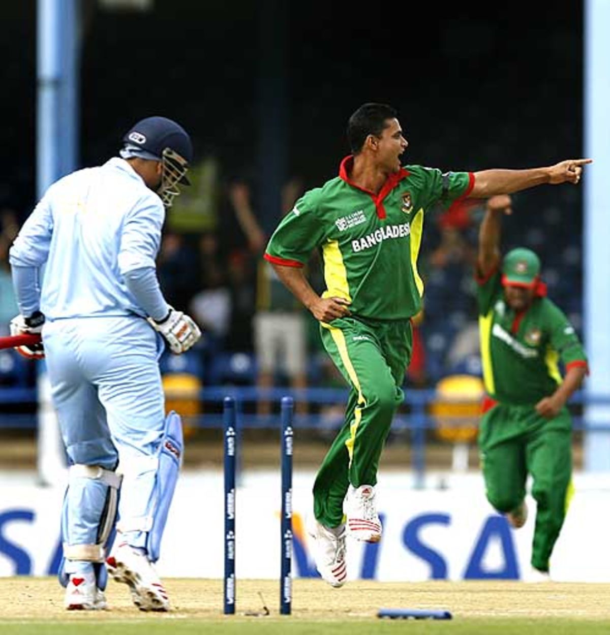 Mashrafe Mortaza is congratulated by the Bangladesh players after he ...