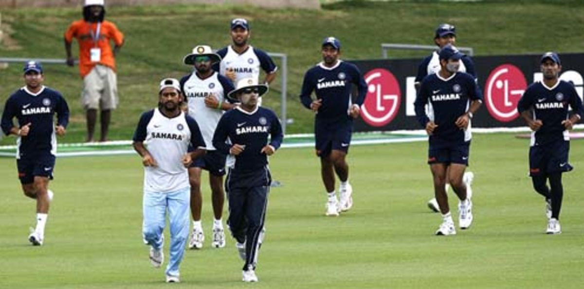 Indian team gather for a huddle while warming up for their final league ...