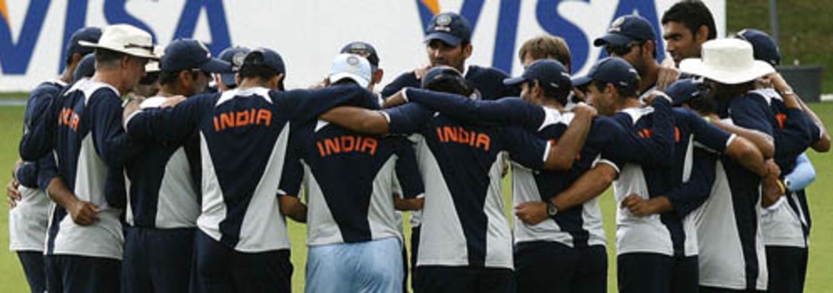 Indian team gather for a huddle while warming up for their final league ...