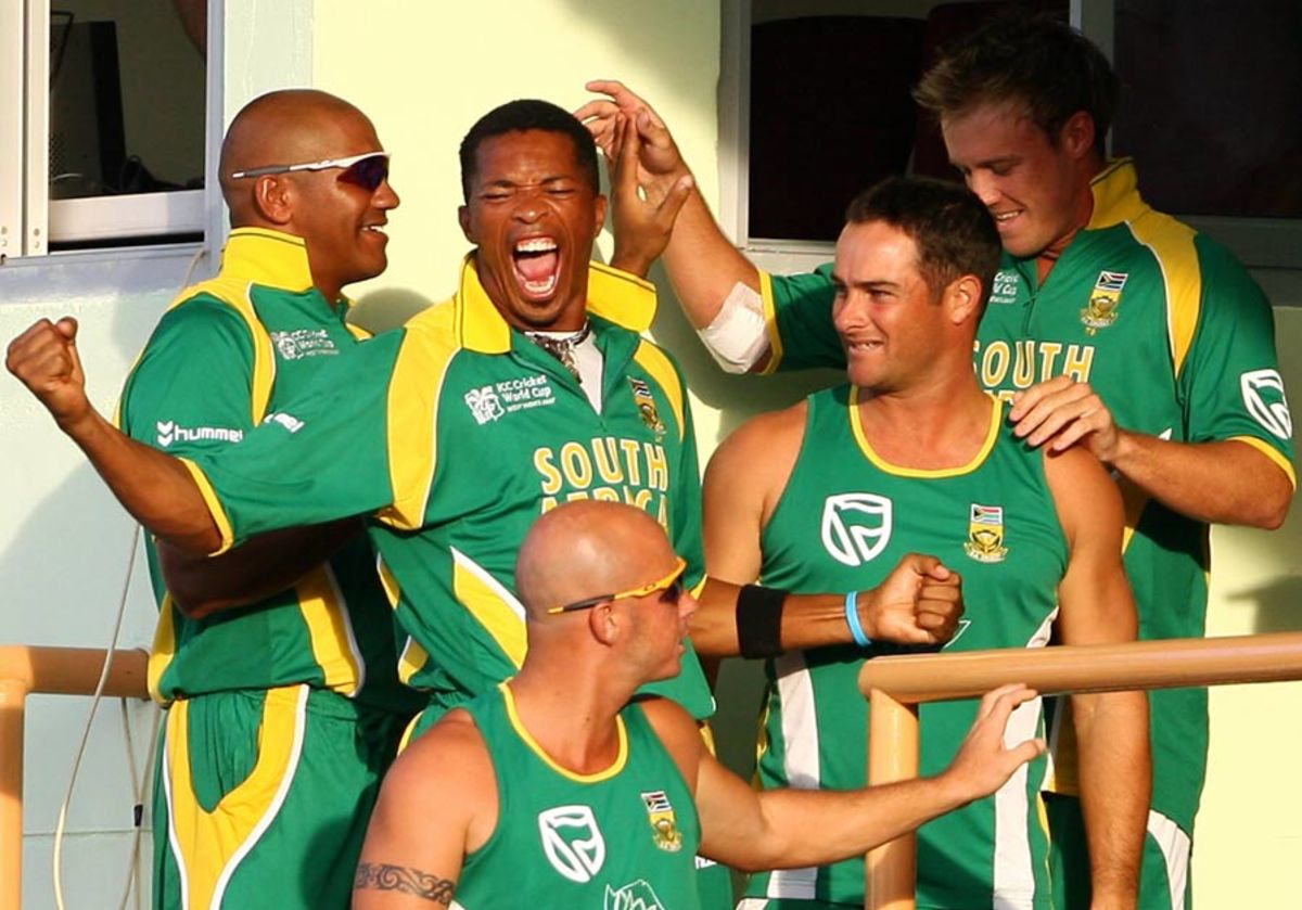 A visibly relieved South African side celebrate their one-wicket win ...