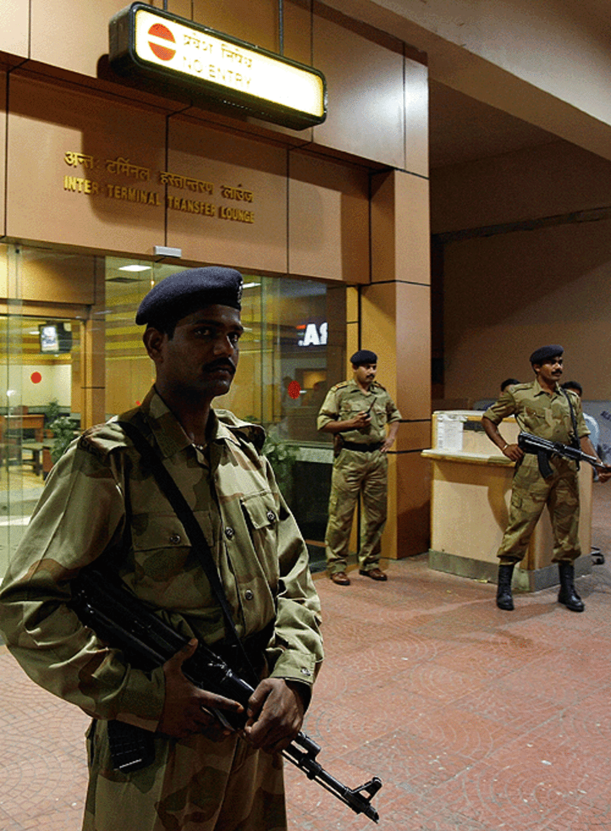 Indian police stand at guard outside the VIP arrival lounge before ...
