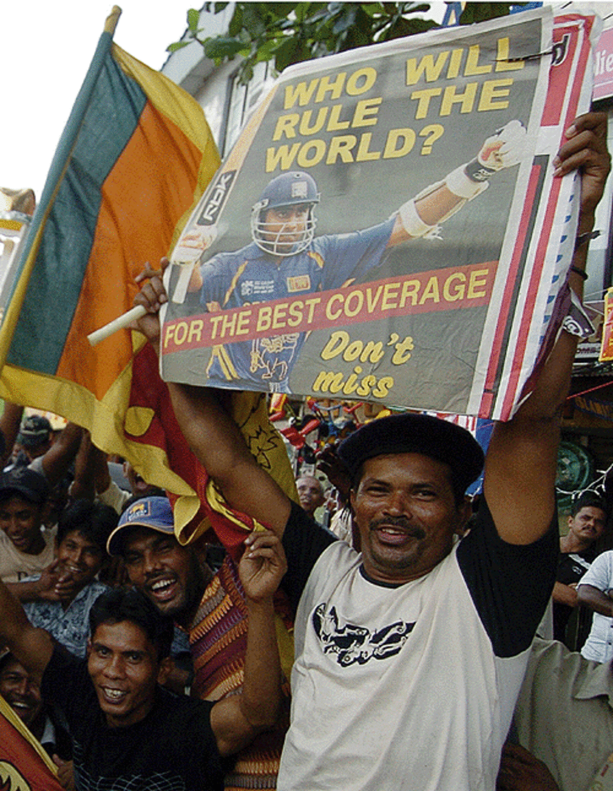 Sri Lankan fans ride down the streets of Colombo waving the national ...