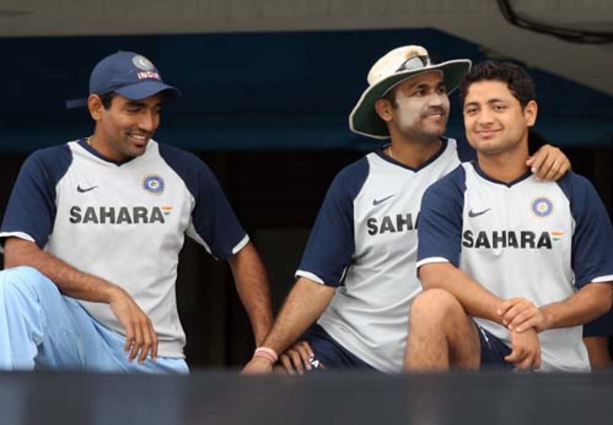 Mahendra Singh Dhoni and RP Singh wait around at India's net practice ...